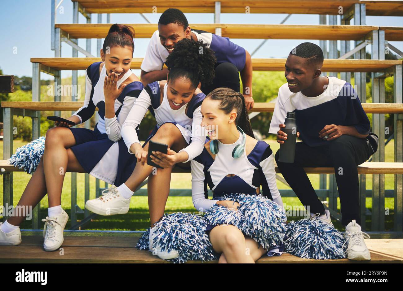 Cheerleader, team and phone for social media, internet scroll and ...