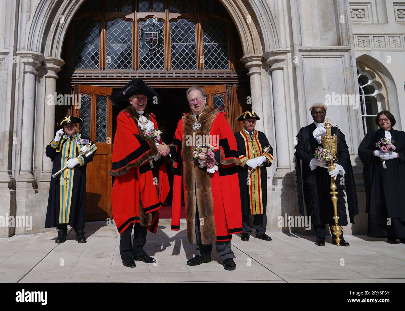 Outgoing Lord Mayor Nicholas Lyons (left) congratulates Alderman ...