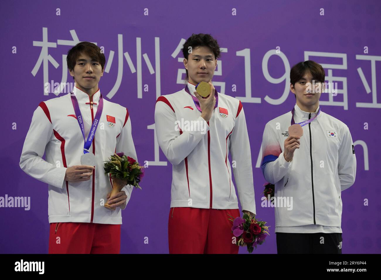 From left, silver medallist China's Sun Jiajun, gold medallist China's Qin Haiyang and bronze ...