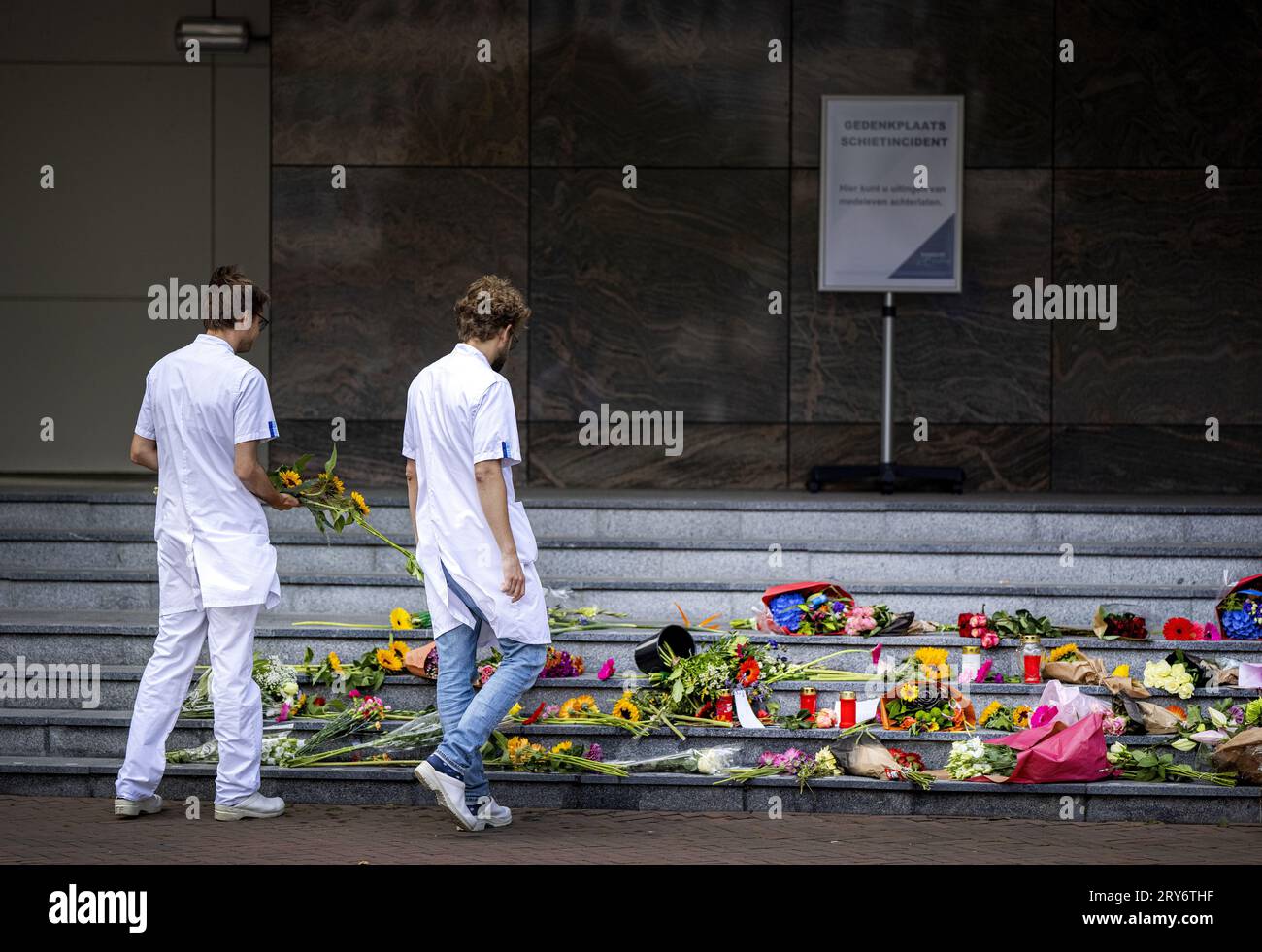 ROTTERDAM - Flowers on the sidewalk of the Erasmus MC, a day after two ...