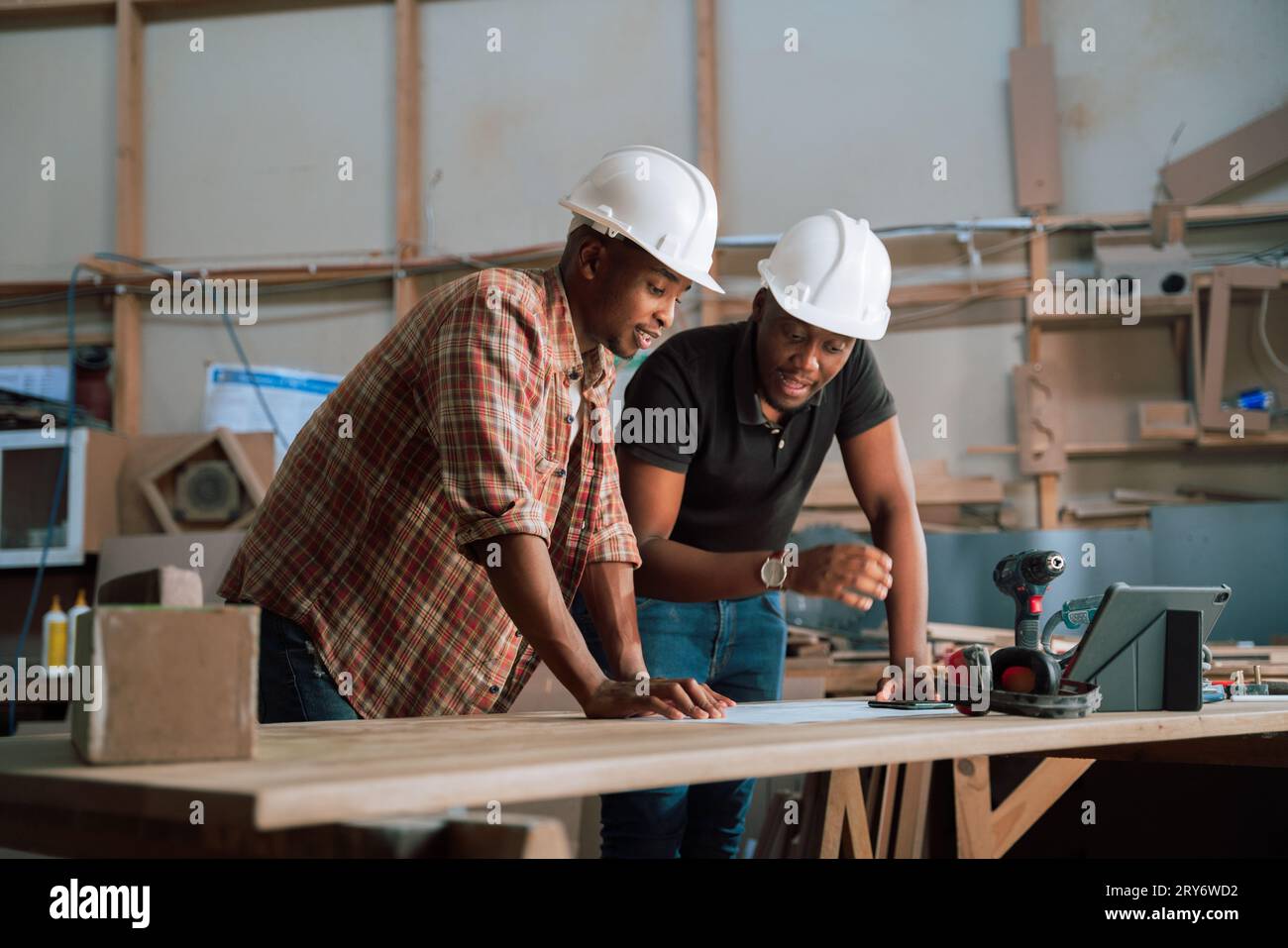 Two craftsmen at work bench hi-res stock photography and images - Alamy