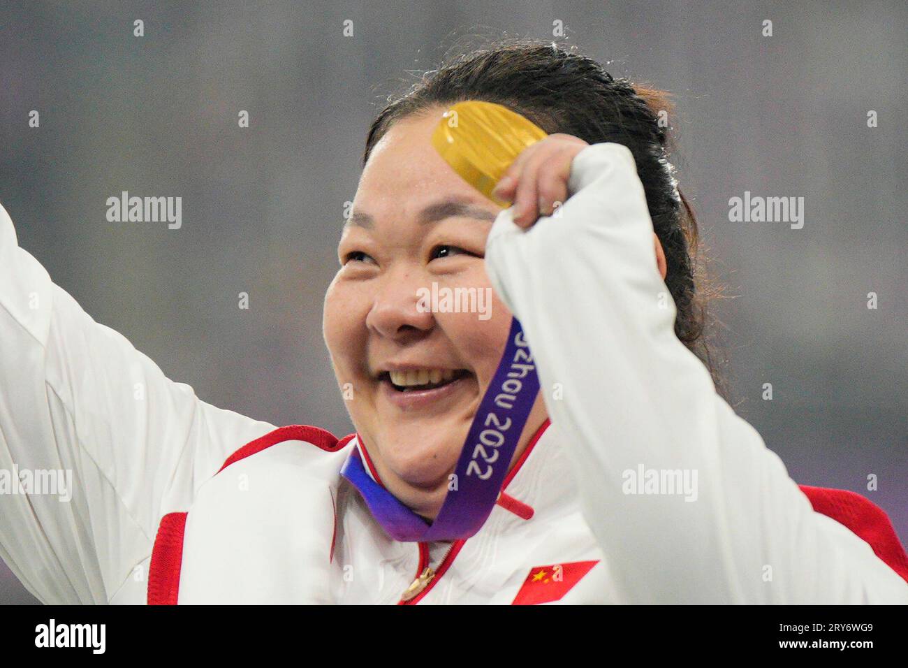 Gold medalist China's Wang Zheng celebrates during the victory ceremony ...