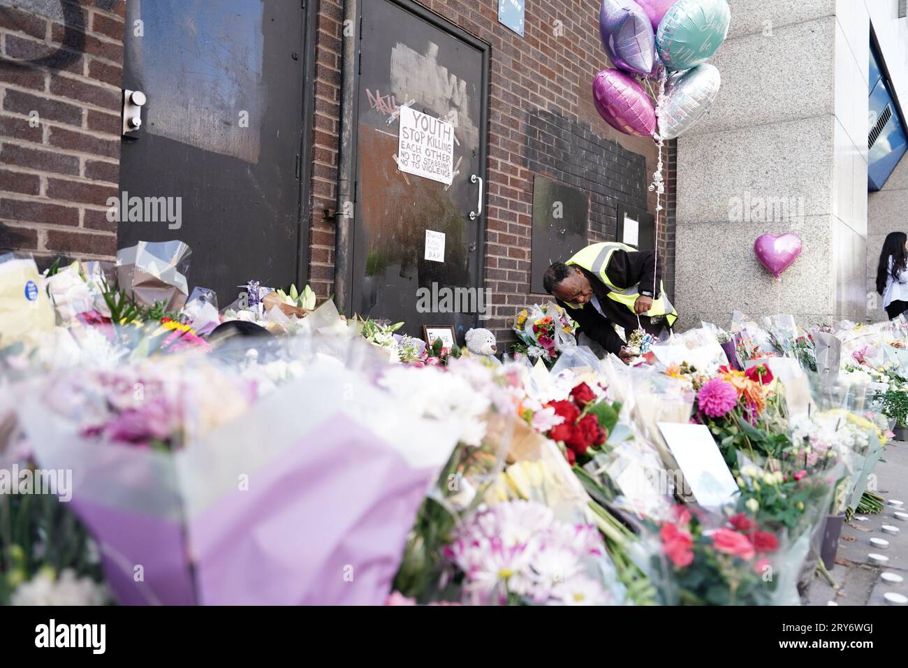 Flowers and tributes at the scene in Croydon, south London, where 15 ...