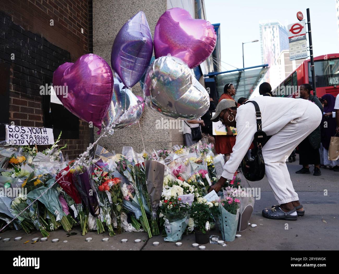 Flowers and tributes at the scene in Croydon, south London, where 15 ...