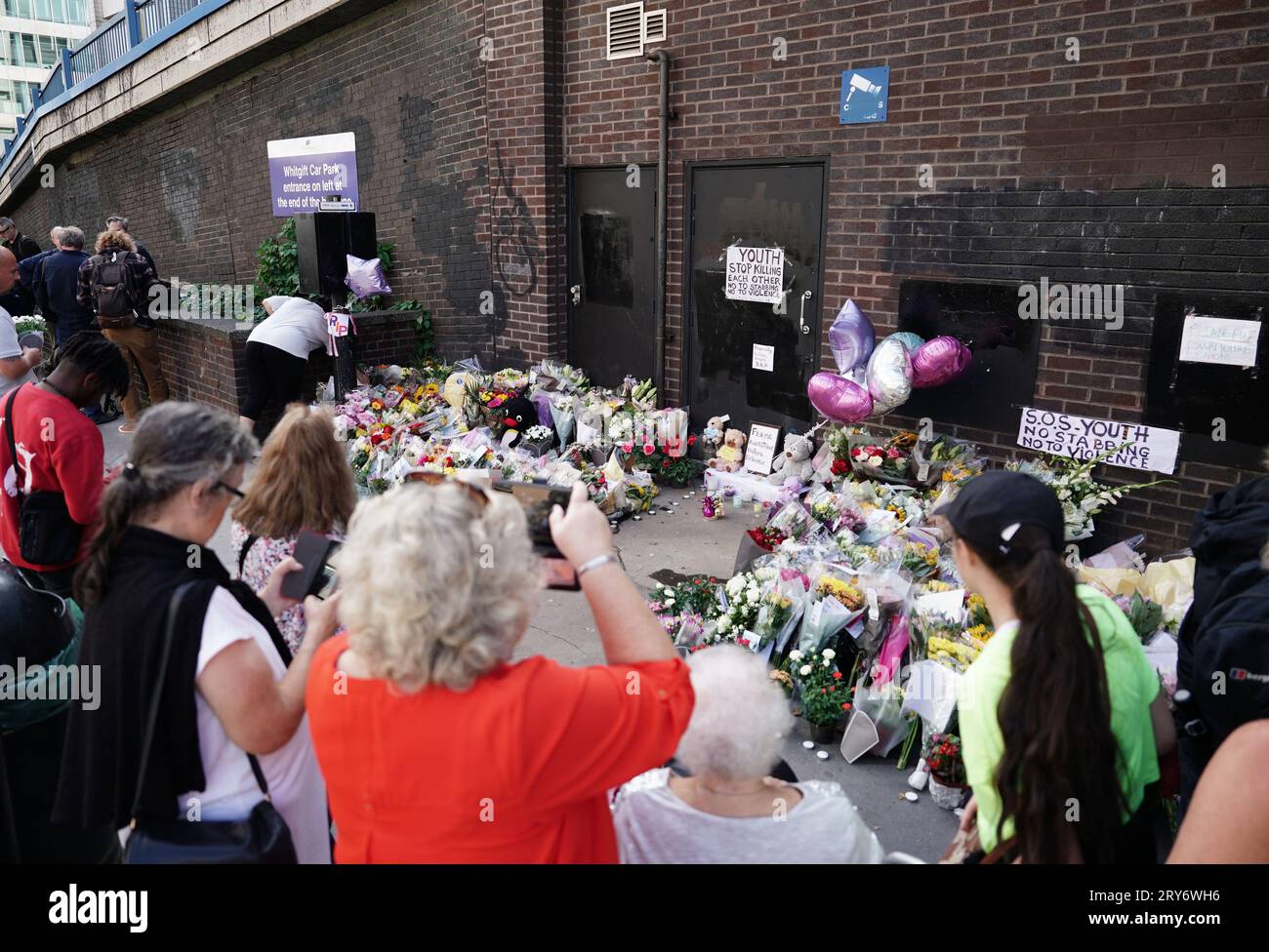 Flowers and tributes at the scene in Croydon, south London, where 15 ...