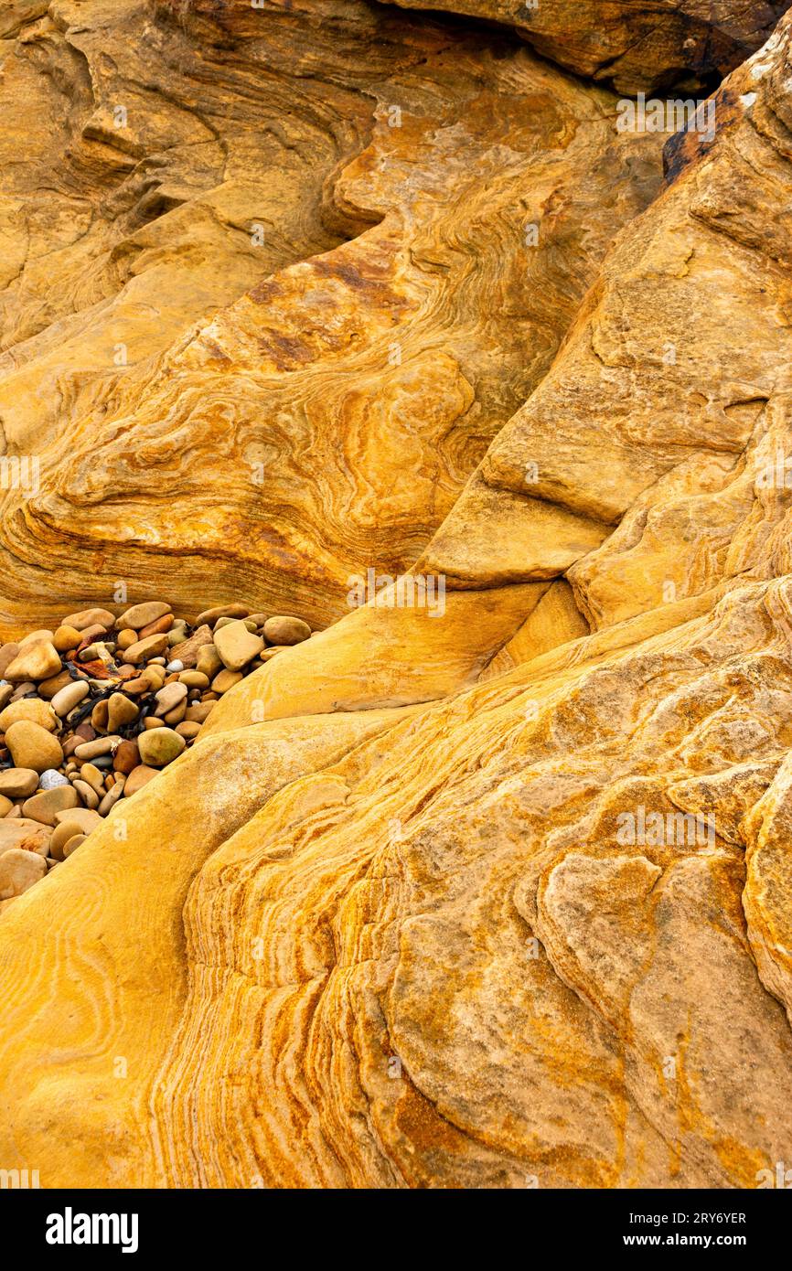 Hopeman Moray Coast Scotland honey or golden coloured sandstone rocks ...