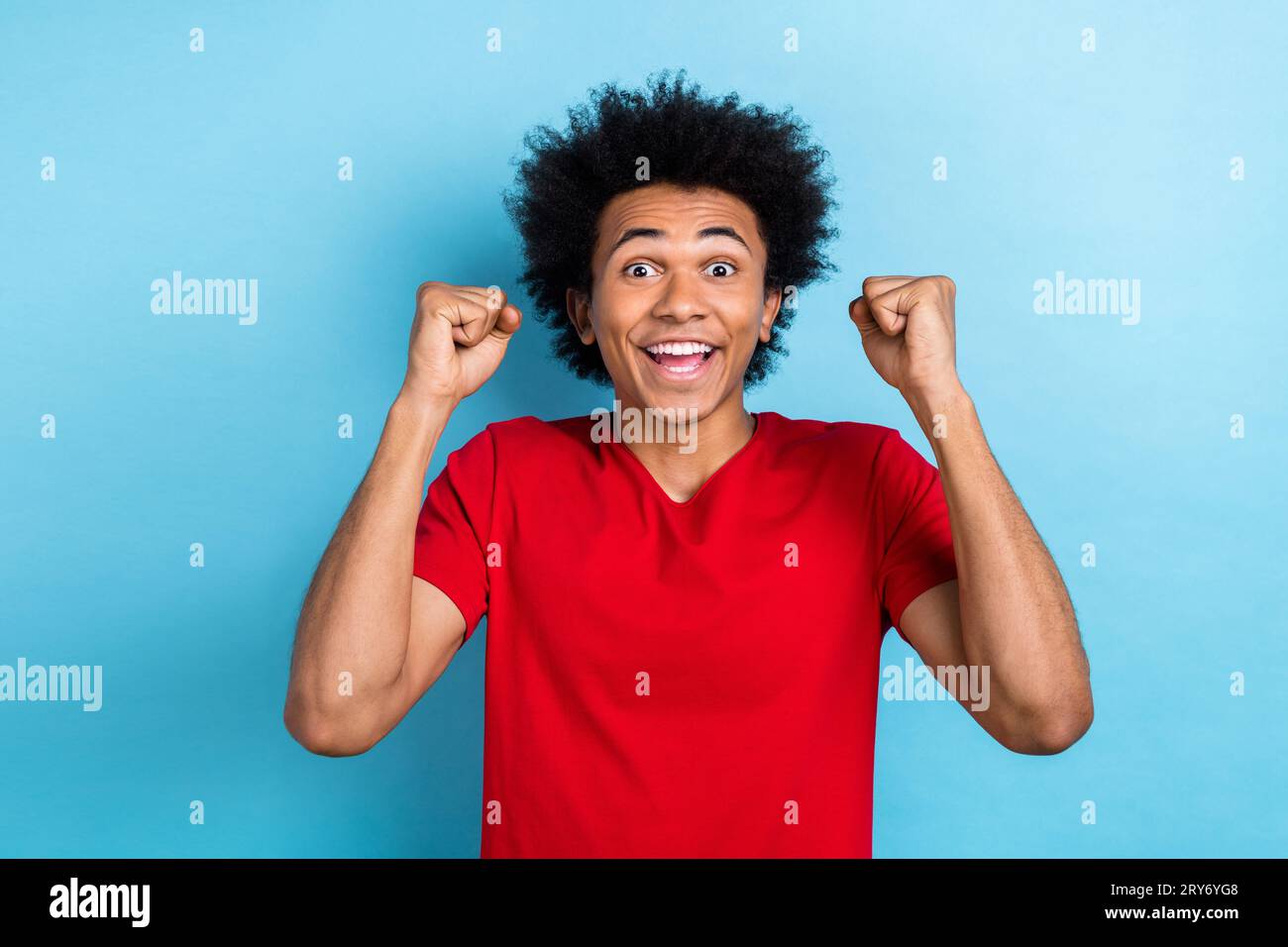 Portrait of excited multiethnic wavy hair youth guy ecstatic expression ...