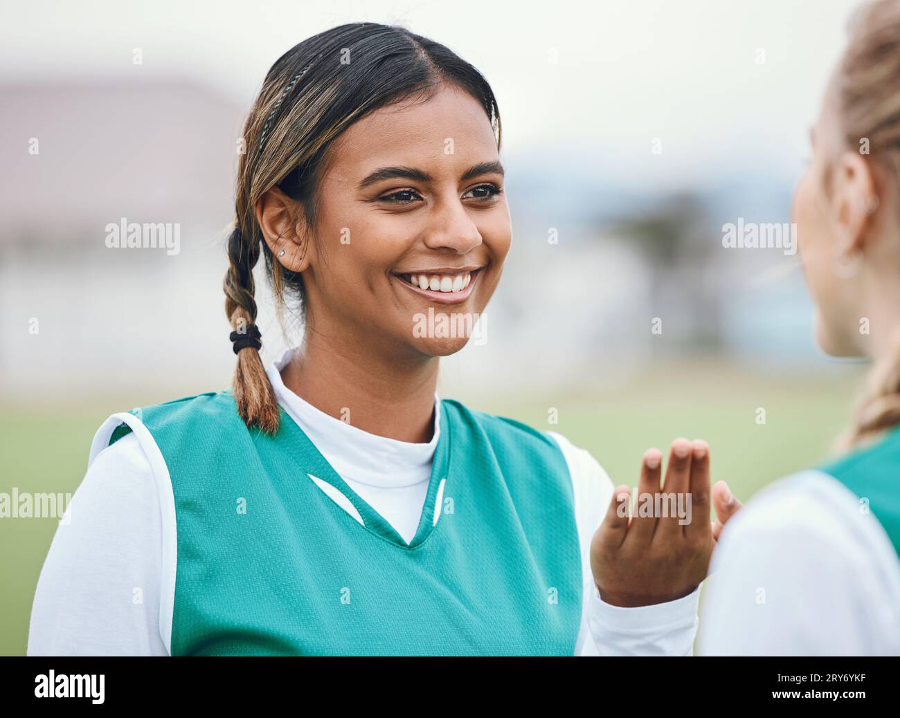 Woman, sport field and smile for hockey or game for competition for ...