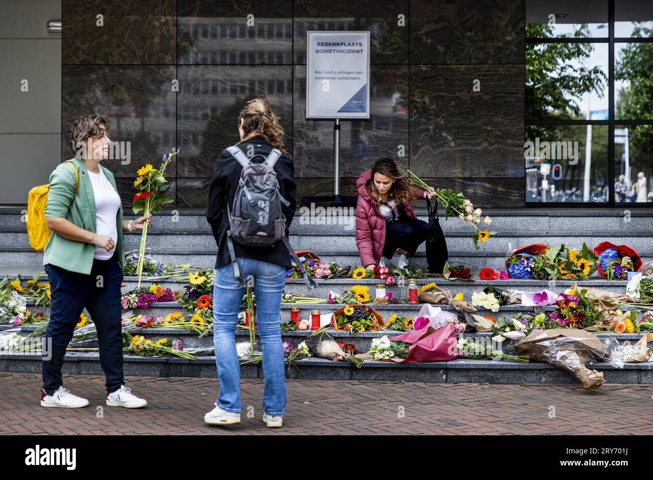 ROTTERDAM - Flowers on the sidewalk of the Erasmus MC, a day after two ...