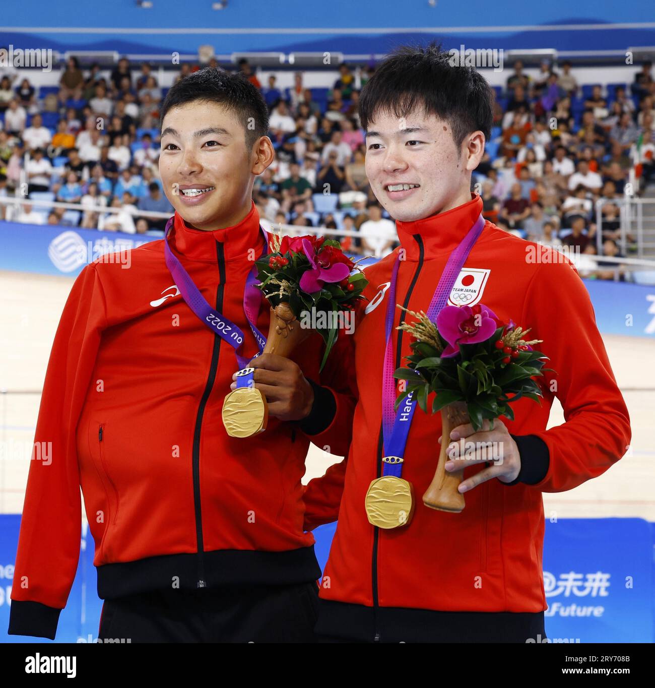 Japanese cyclists Naoki Kojima (R) and Shunsuke Imamura pose after winning gold in the men's ...