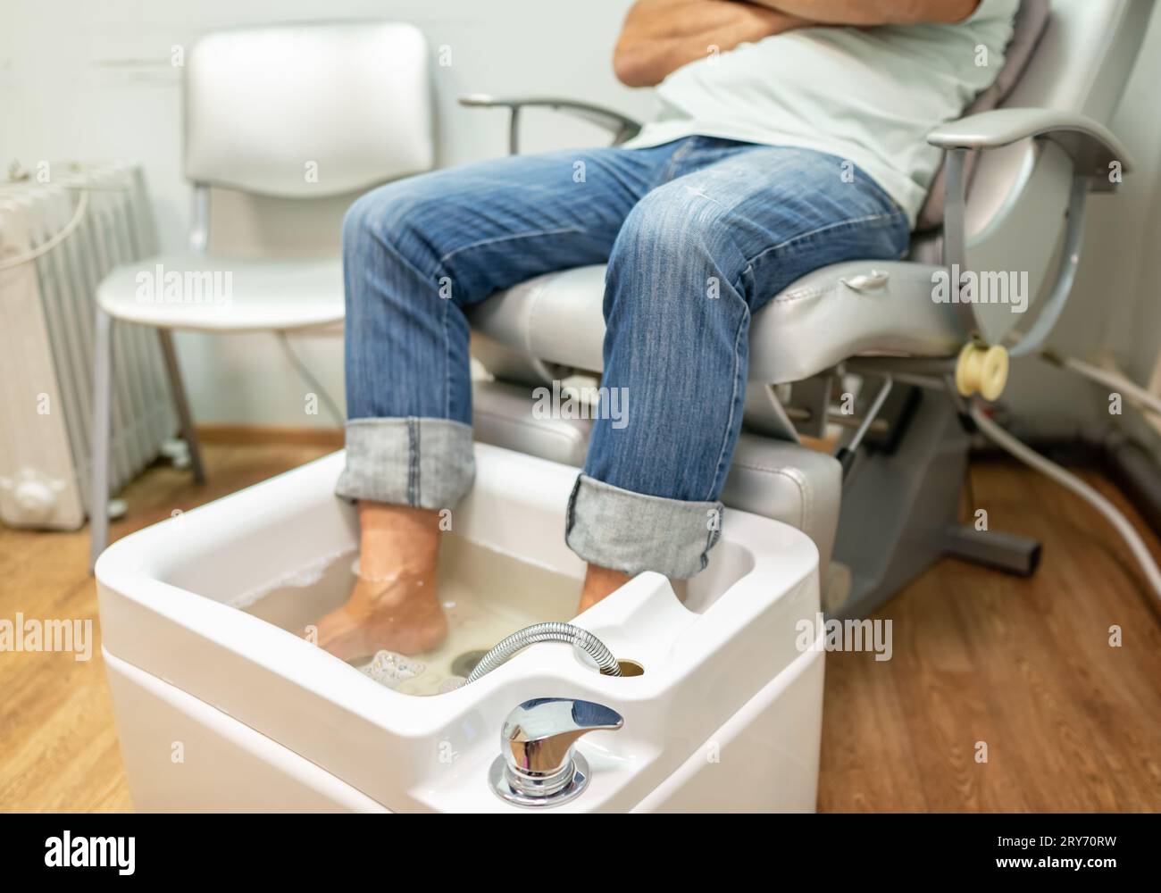 concept of male pedicure, foot pedicure, cosmetologist makes classic ...