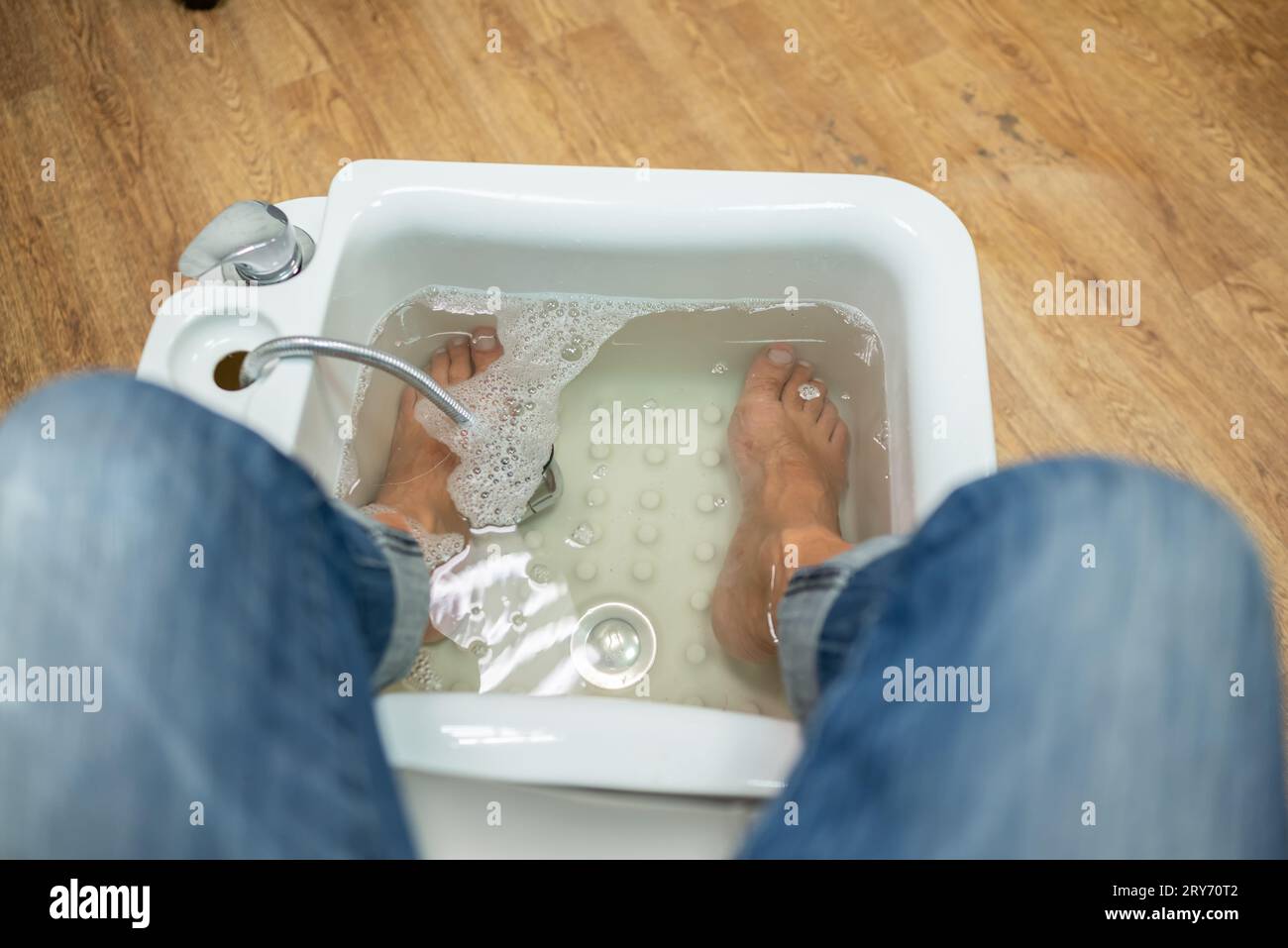 concept of male pedicure, foot pedicure, cosmetologist makes classic ...