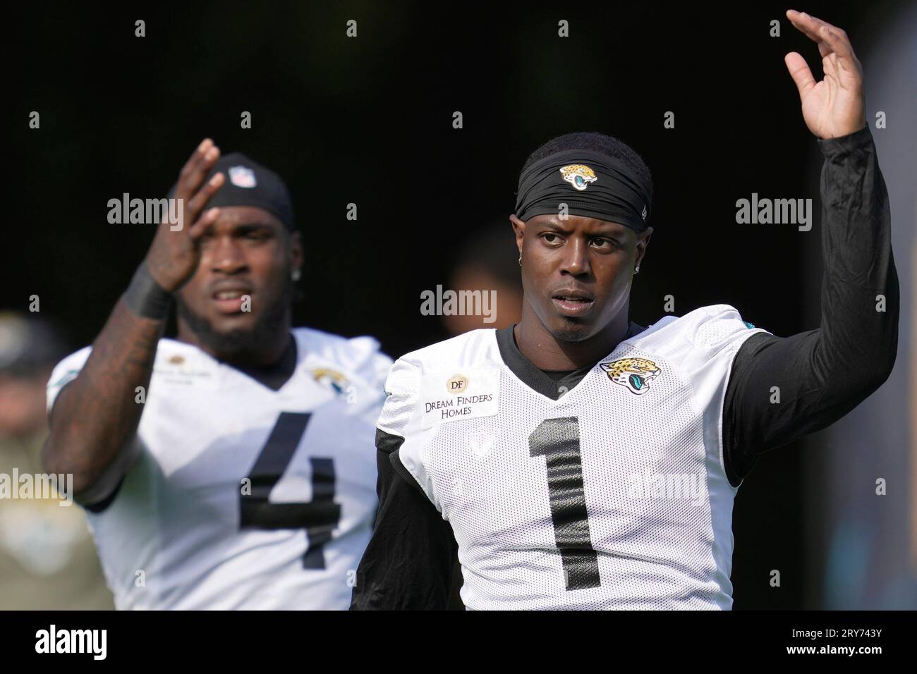 Jacksonville Jaguars' Travis Etienne Jr., right, and Tank Bigsby attend ...