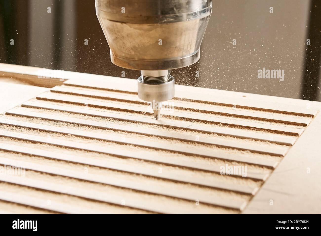Cnc machine at carpentry workshop. Cutting wood with various router ...