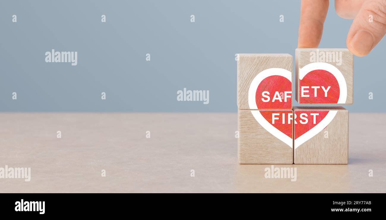 Wooden cubes with Safety first symbols, work safety, caution work ...