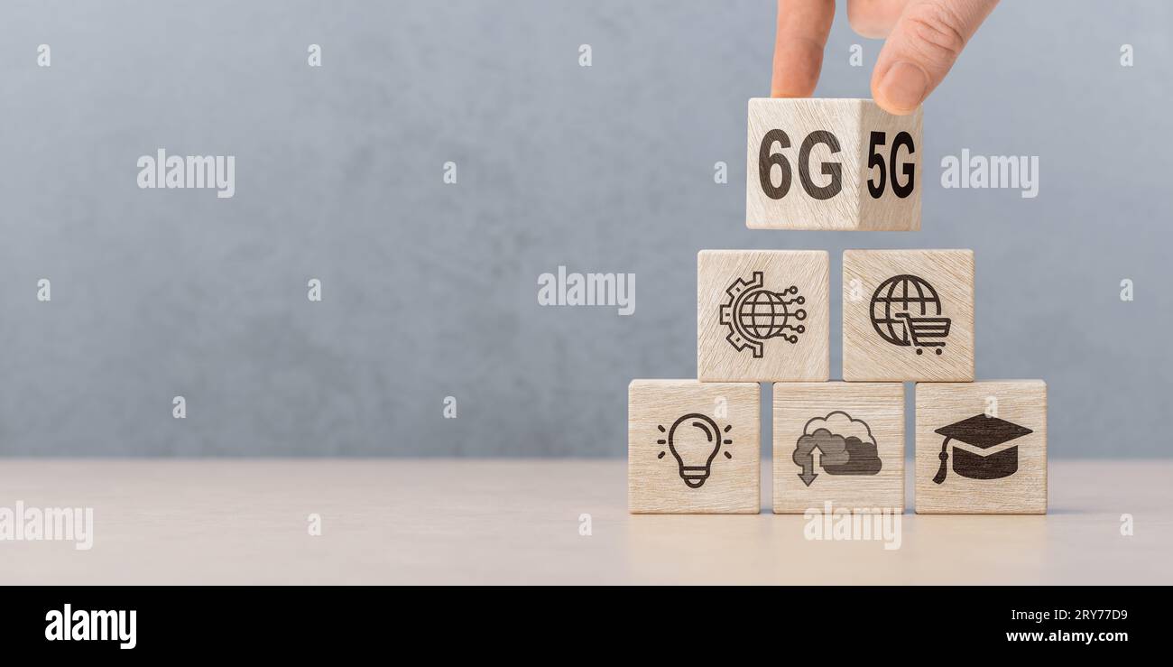 6G network technology. hand turns wooden cube and changes sign 5G to 6G ...