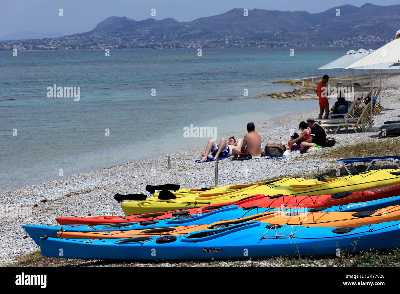 Colourful kayaks on the shore at Skala, Agistri, Saronic Islands group ...