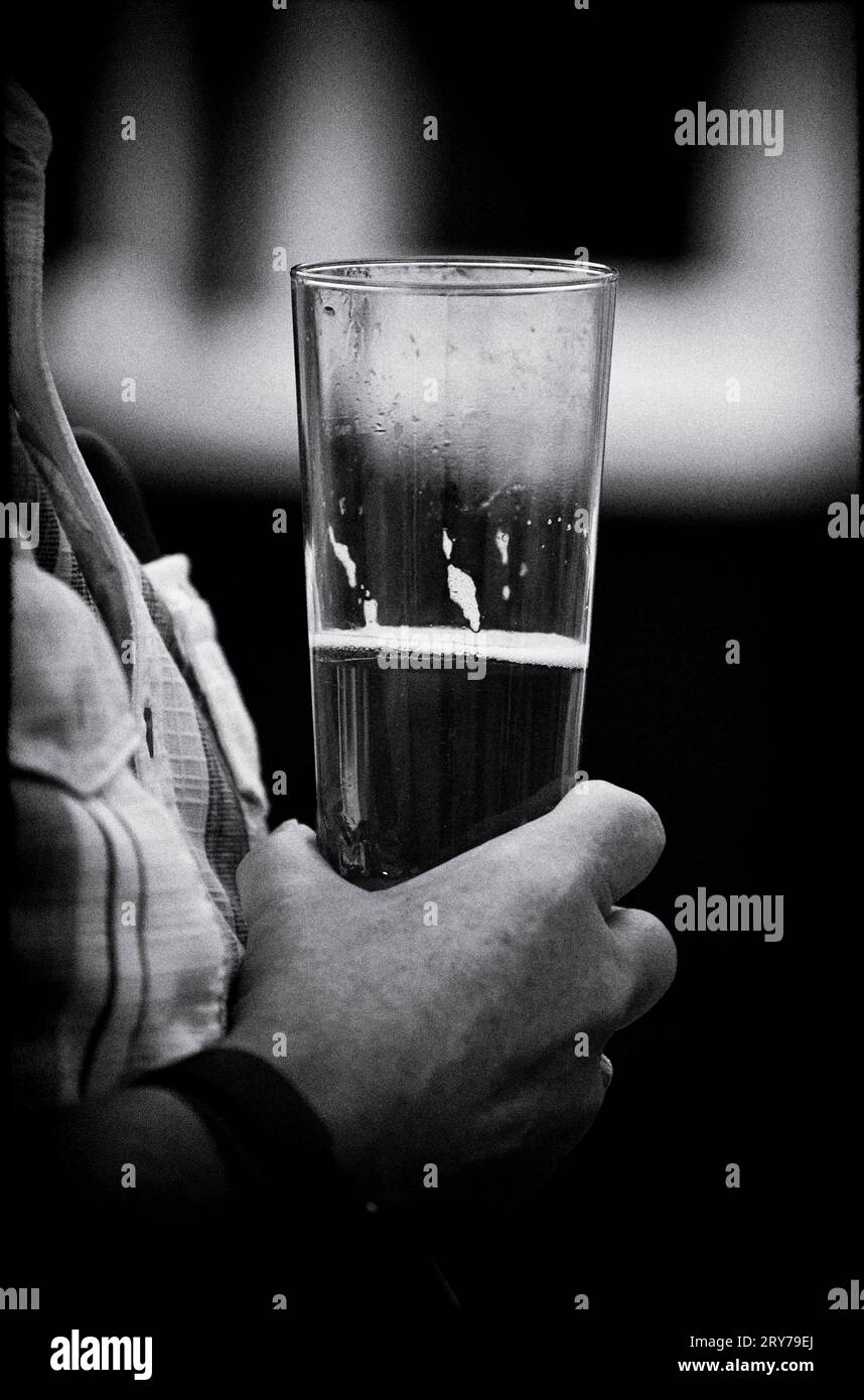 Hand holding empty drinking glass hi-res stock photography and images ...