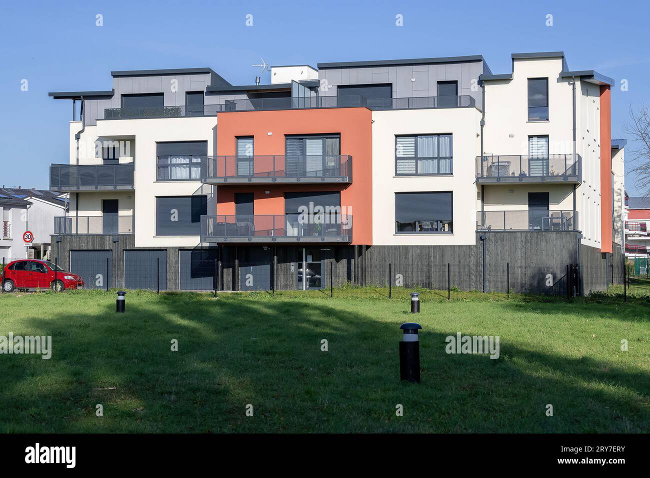 Modern residential building with grass Stock Photo - Alamy
