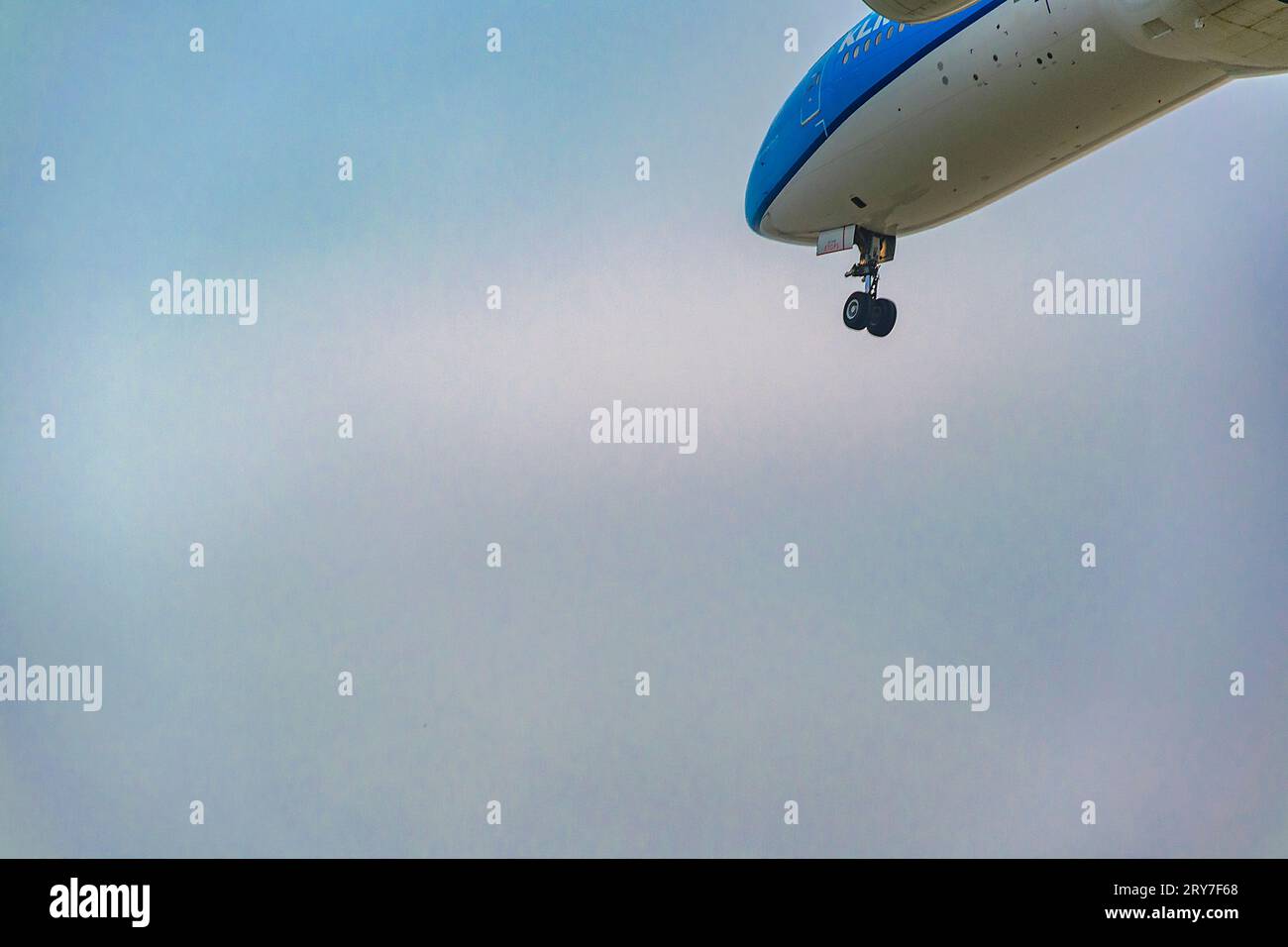 Low angle shot commercial plane flying at cloudy sky, samborondon ...