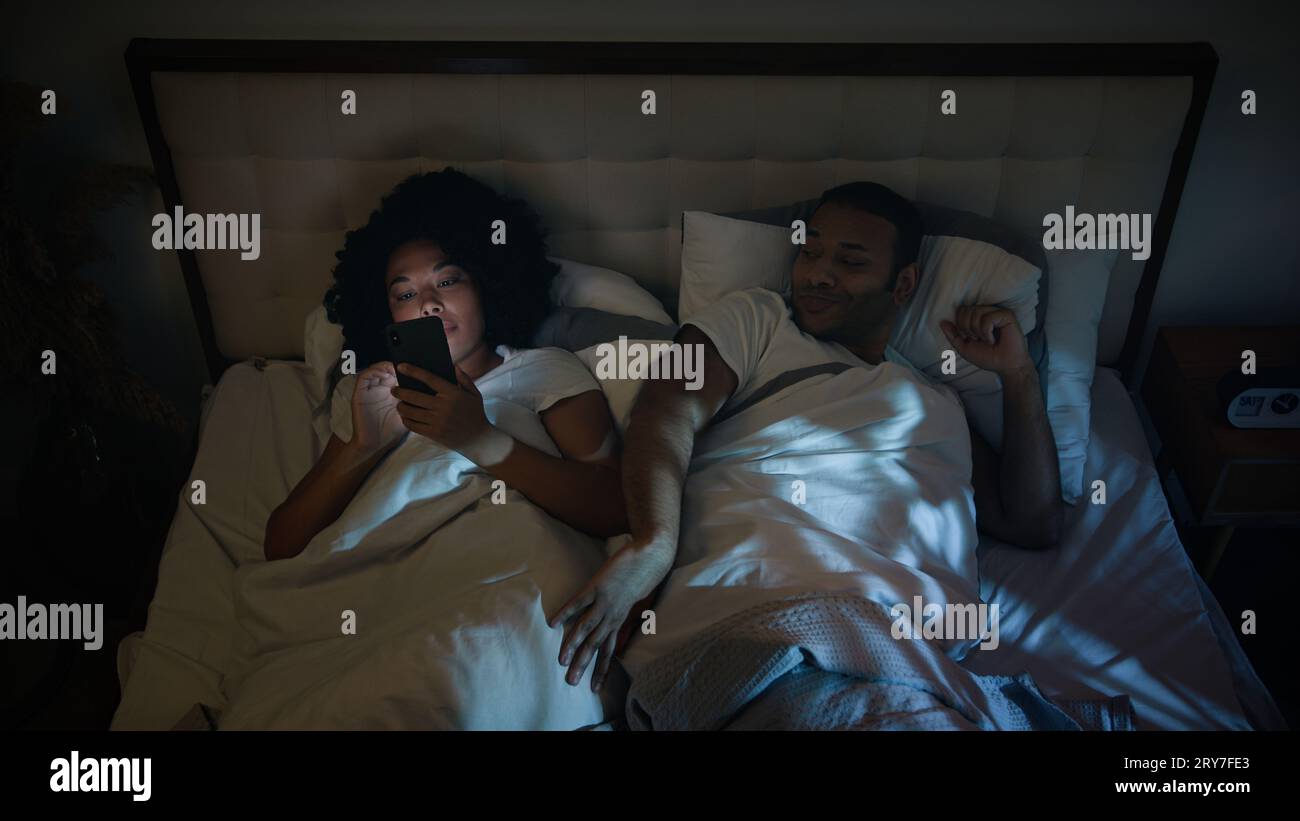 Irritated African American man boyfriend trying sleep husband angry ...