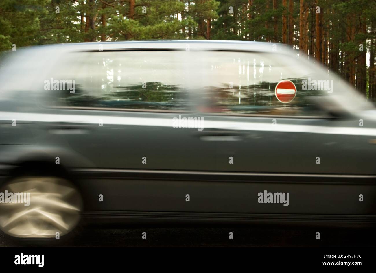 Traffic sign Entrance is forbidden through a window of the passing car ...