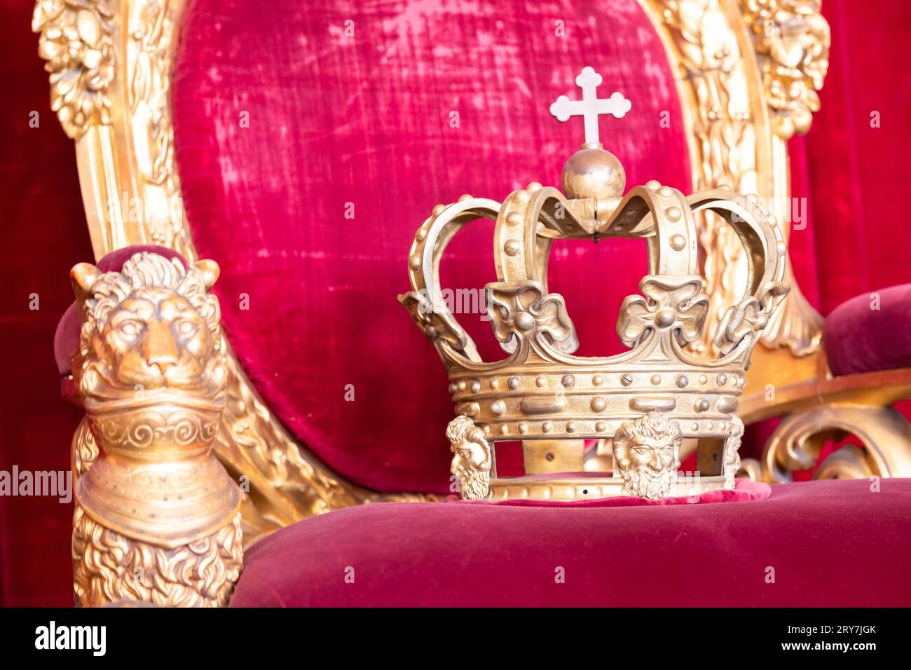 Ancient crown on red velvet. Antique symbol of authority, luxury ...