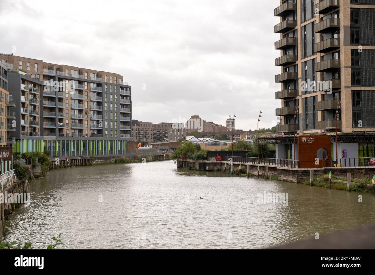 Modern building block of flats on the River Ravensbourne, aka Deptford ...