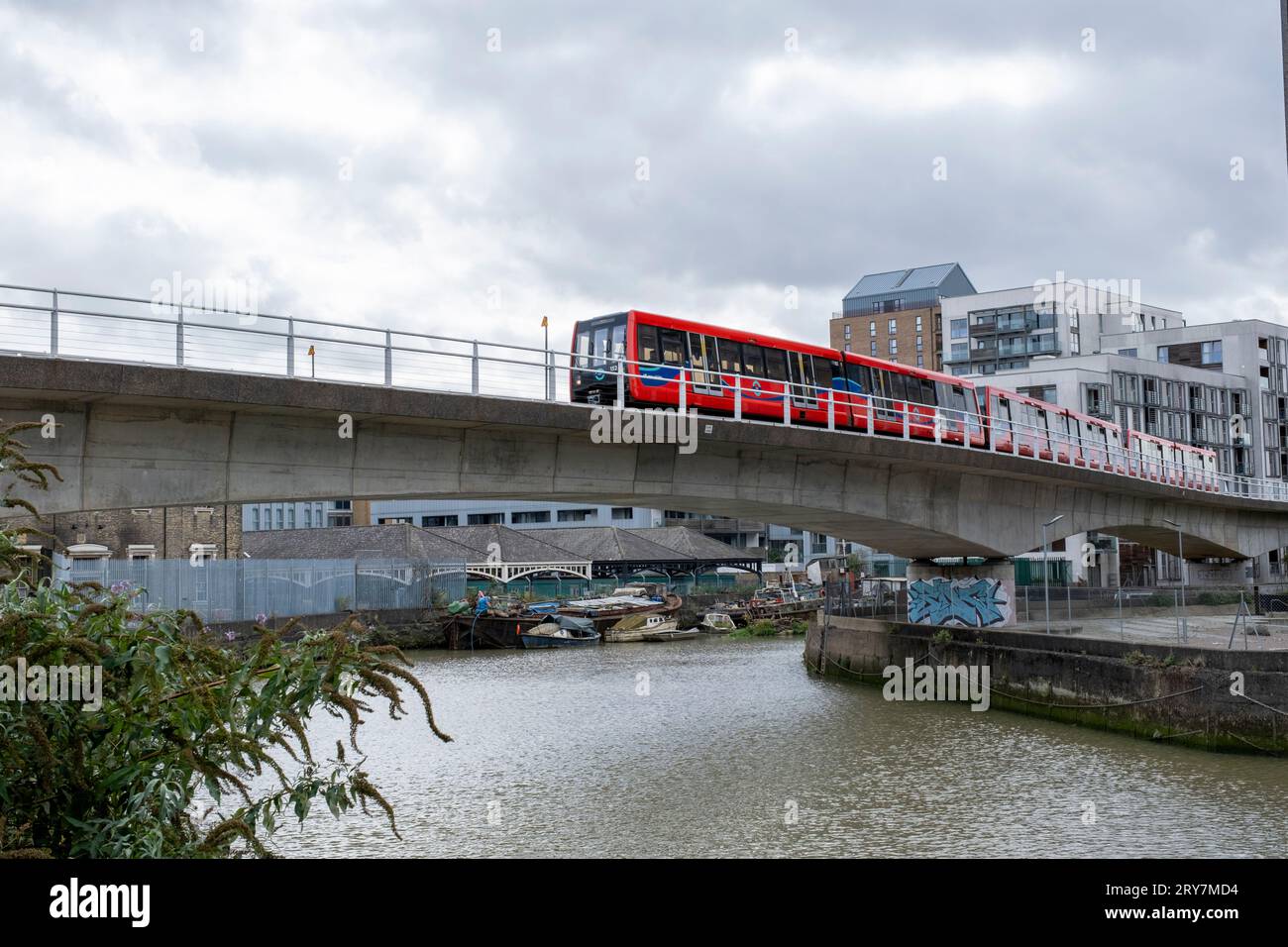 Docklands Light Railway DLR train crossing the River Ravensbourne, aka ...