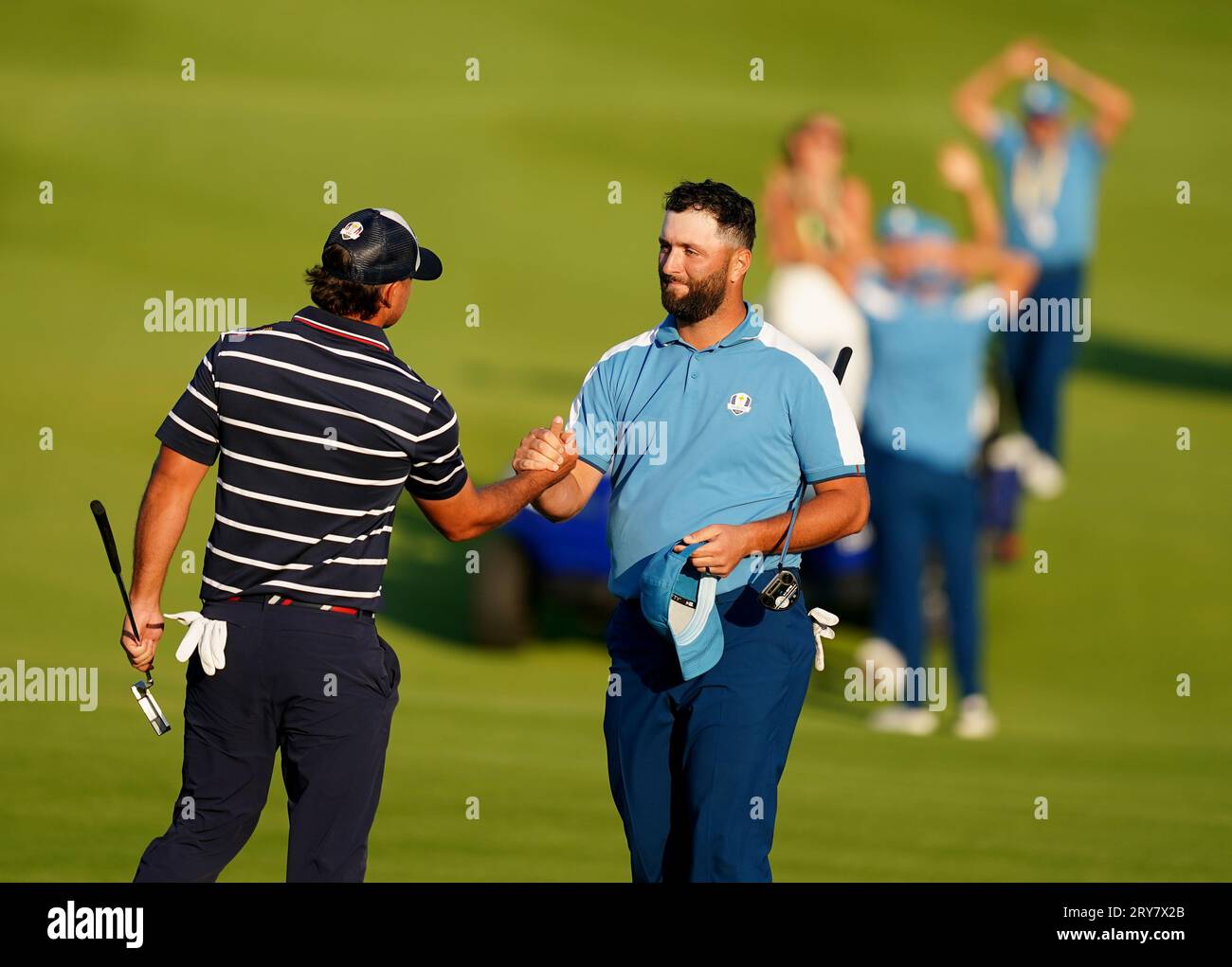 USA's Brooks Koepka shakes hands with Team Europe's Jon Rahm following ... USA's Brooks Koepka shakes hands with Team Europe's Jon Rahm following ...