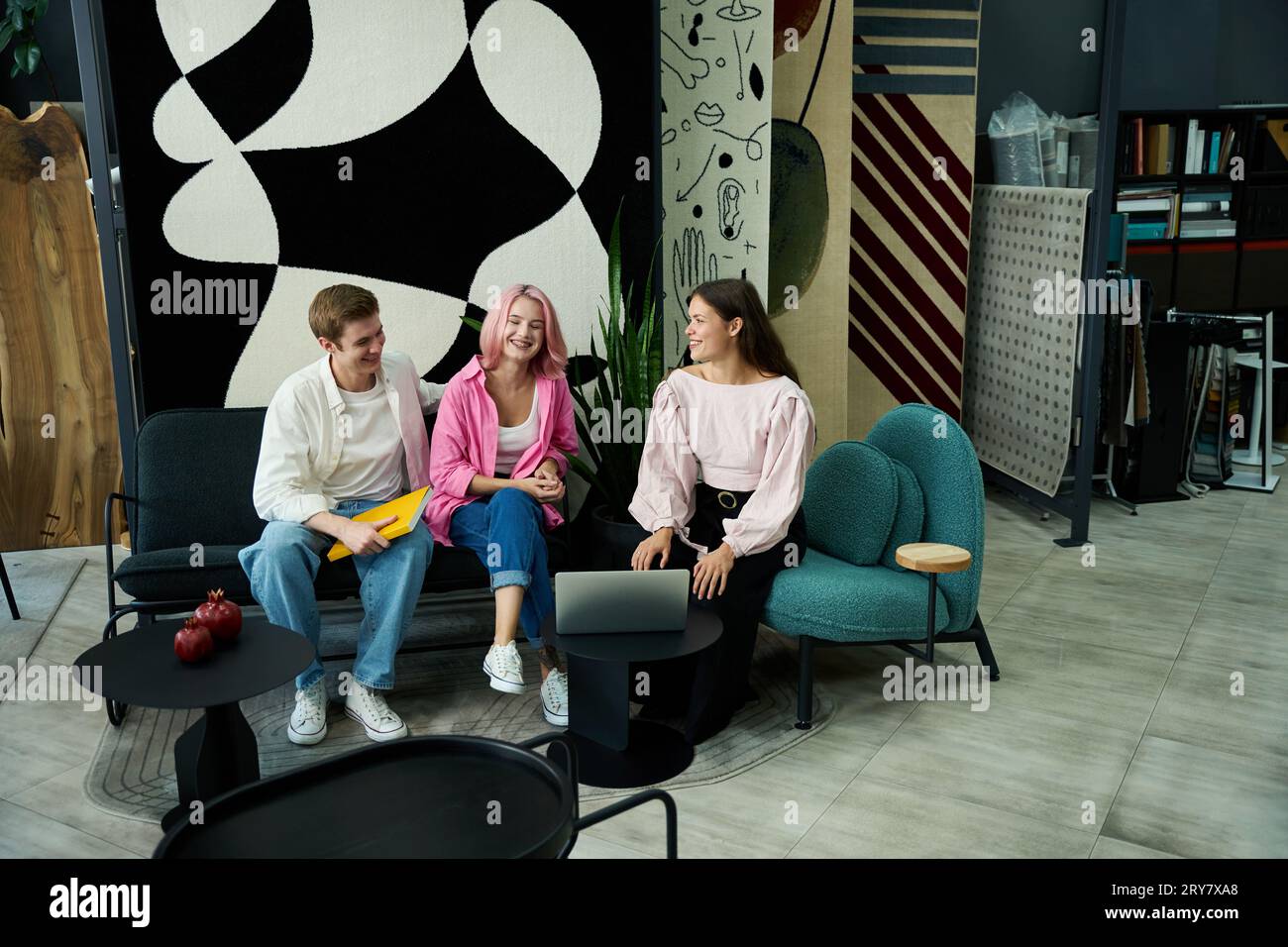 Three people, a woman consultant and a young couple Stock Photo - Alamy