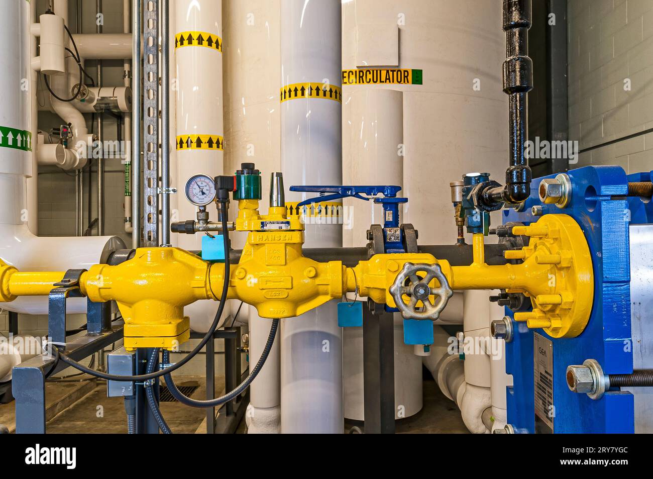 Piping, valves, and gauges in the compressor room of a cold-storage ...