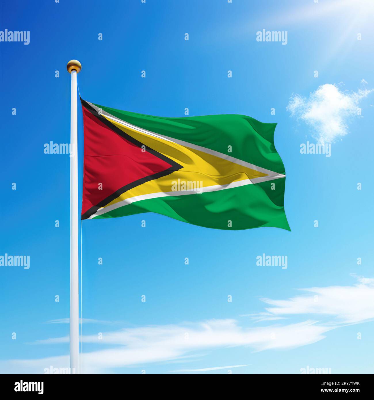 Waving flag of Guyana on flagpole with sky background. Template for independence day Stock Photo ...