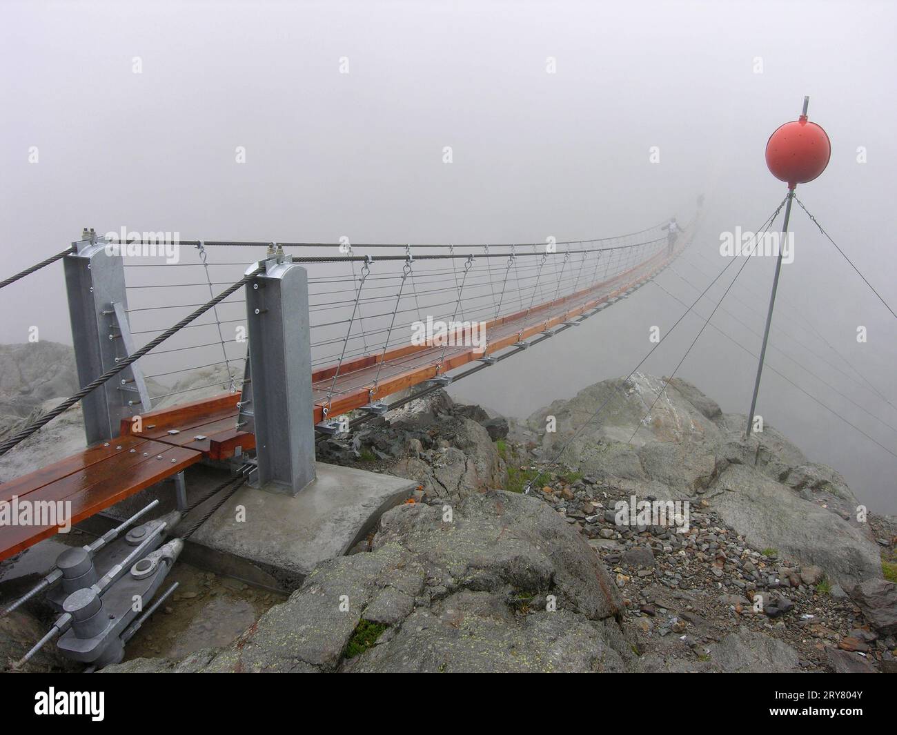 Rope bridge in fog, Swiss Alps Stock Photo - Alamy