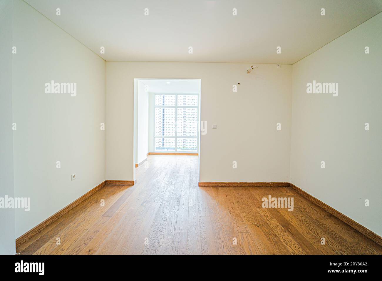 The room is both cozy and spacious, and it's currently empty. The vinyl ...