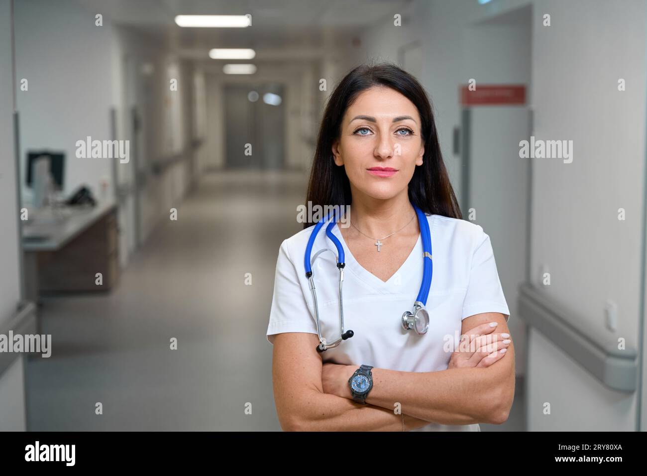 Female doctor in a bright hospital corridor Stock Photo - Alamy