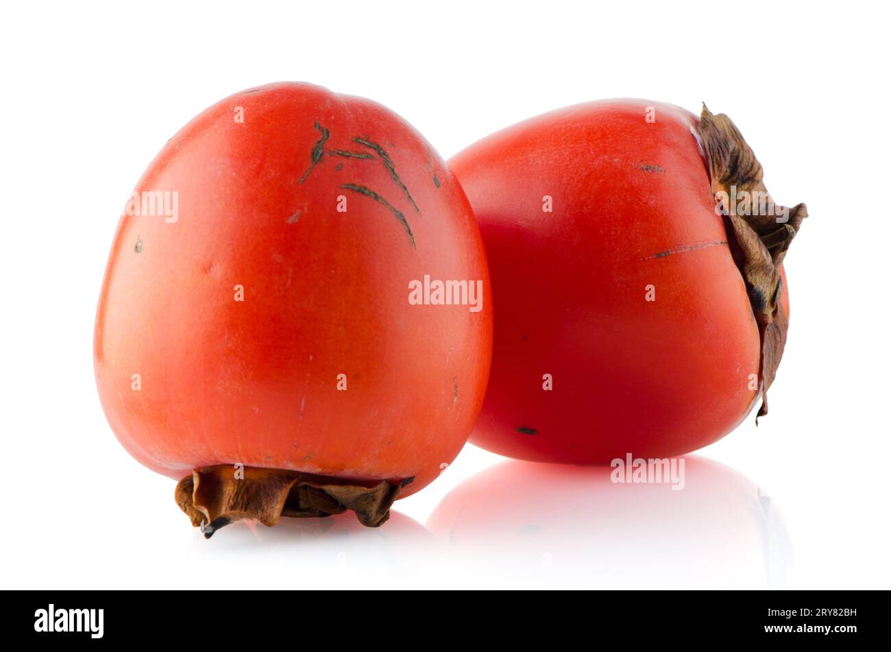Red ripe persimmons Stock Photo - Alamy