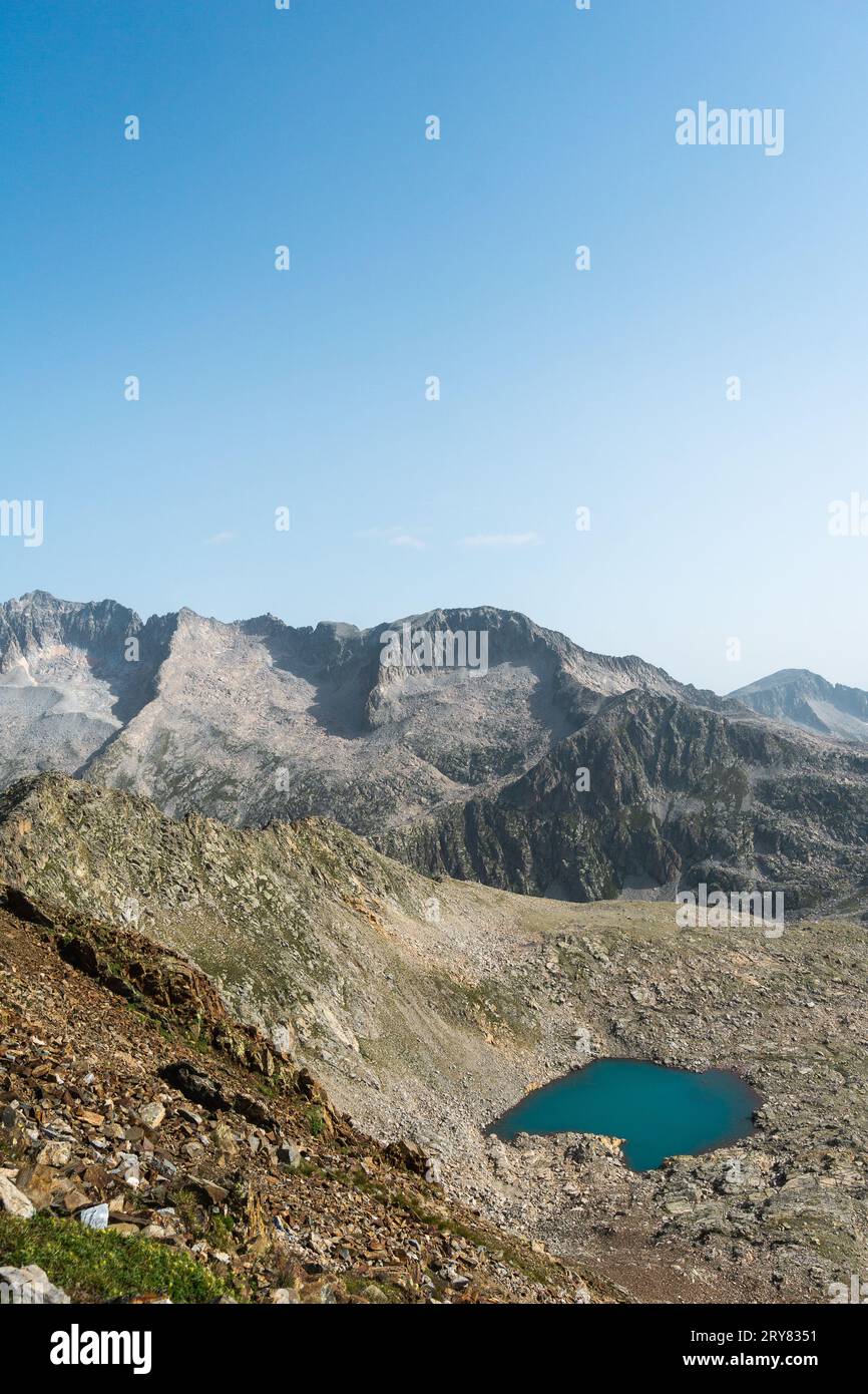 View over mountain range with blue lake in Spanish Pyrenees Stock Photo ...