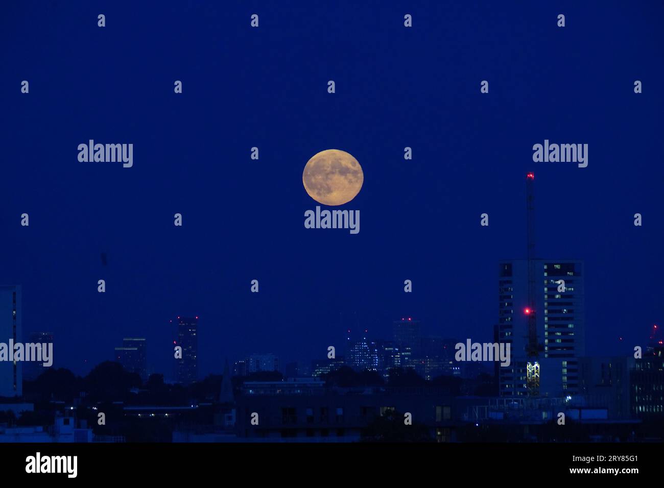 A supermoon is visible above the London skyline. The moon will be near ...