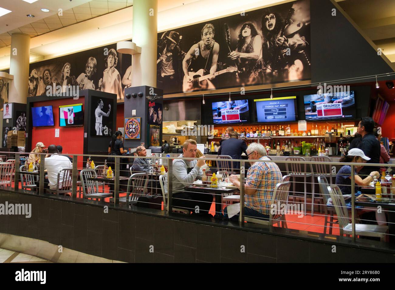 LAX terminal restaurant with mural of rock and roll celebrities. Los ...