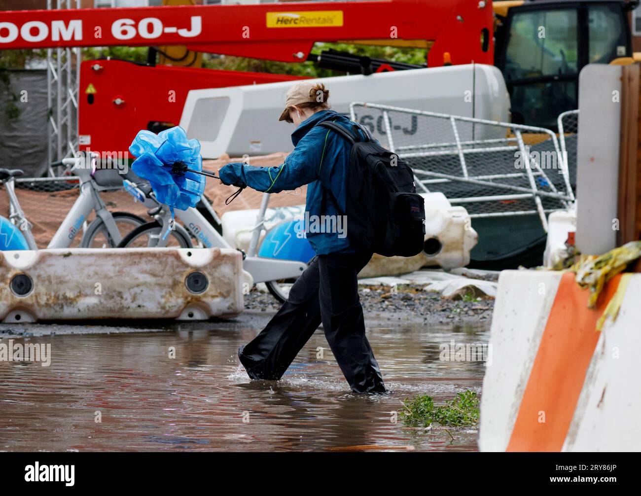 New York, United States. 29th Sep, 2023. A pedestrian walks through a ...