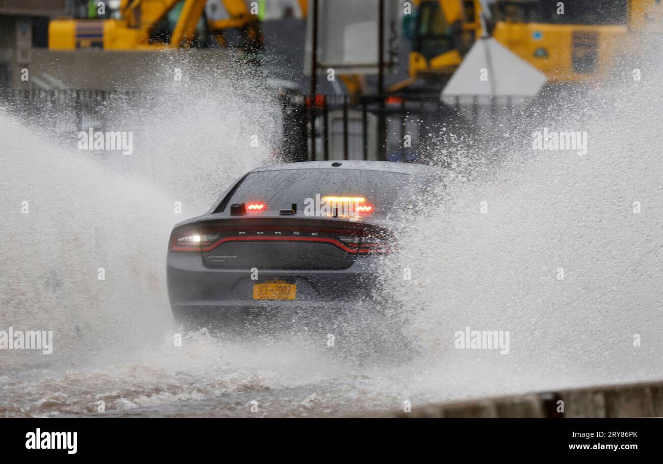 New York, United States. 29th Sep, 2023. An emergency vehicle drives ...