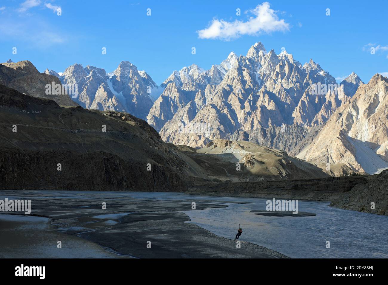 Adventure tourist on a zipline across the Hunza River in Pakistan Stock ...