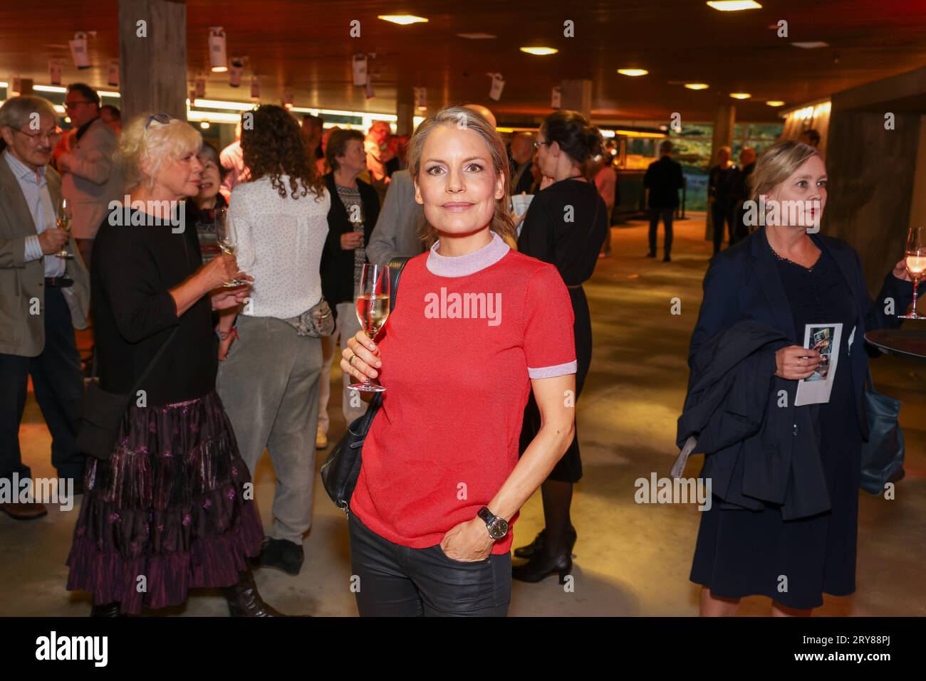 Berlin, Germany. 29th Sep, 2023. The moderator Katja Losch comes to the ...
