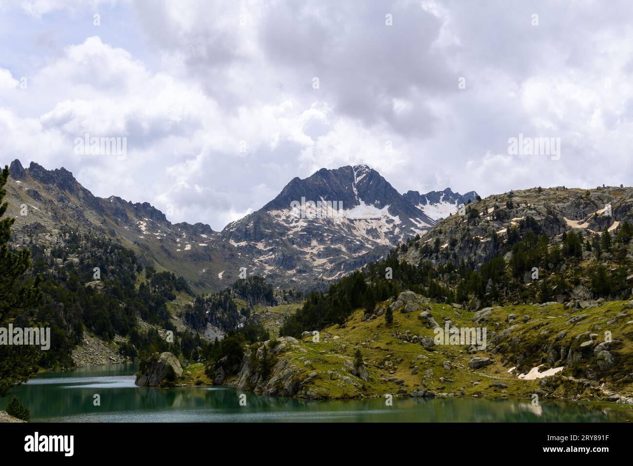 Lake with mountain in the horizon in spring in Spanish Pyrenees ...