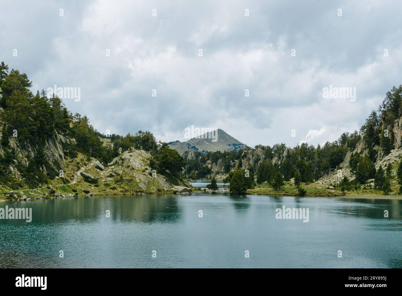 Lake with mountain in the horizon in spring in Spanish Pyrenees ...