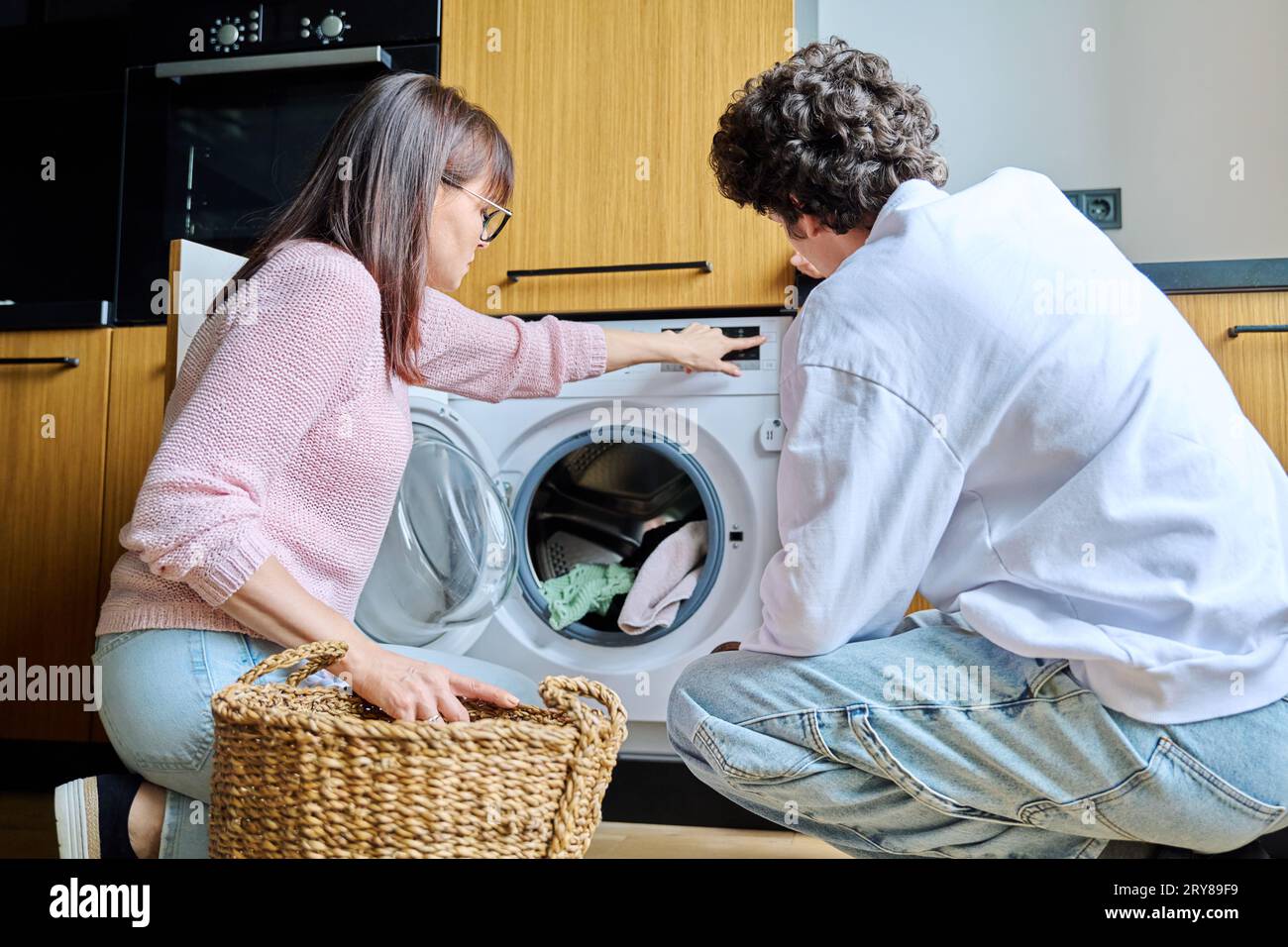 Teenager and washing machine hi-res stock photography and images - Alamy