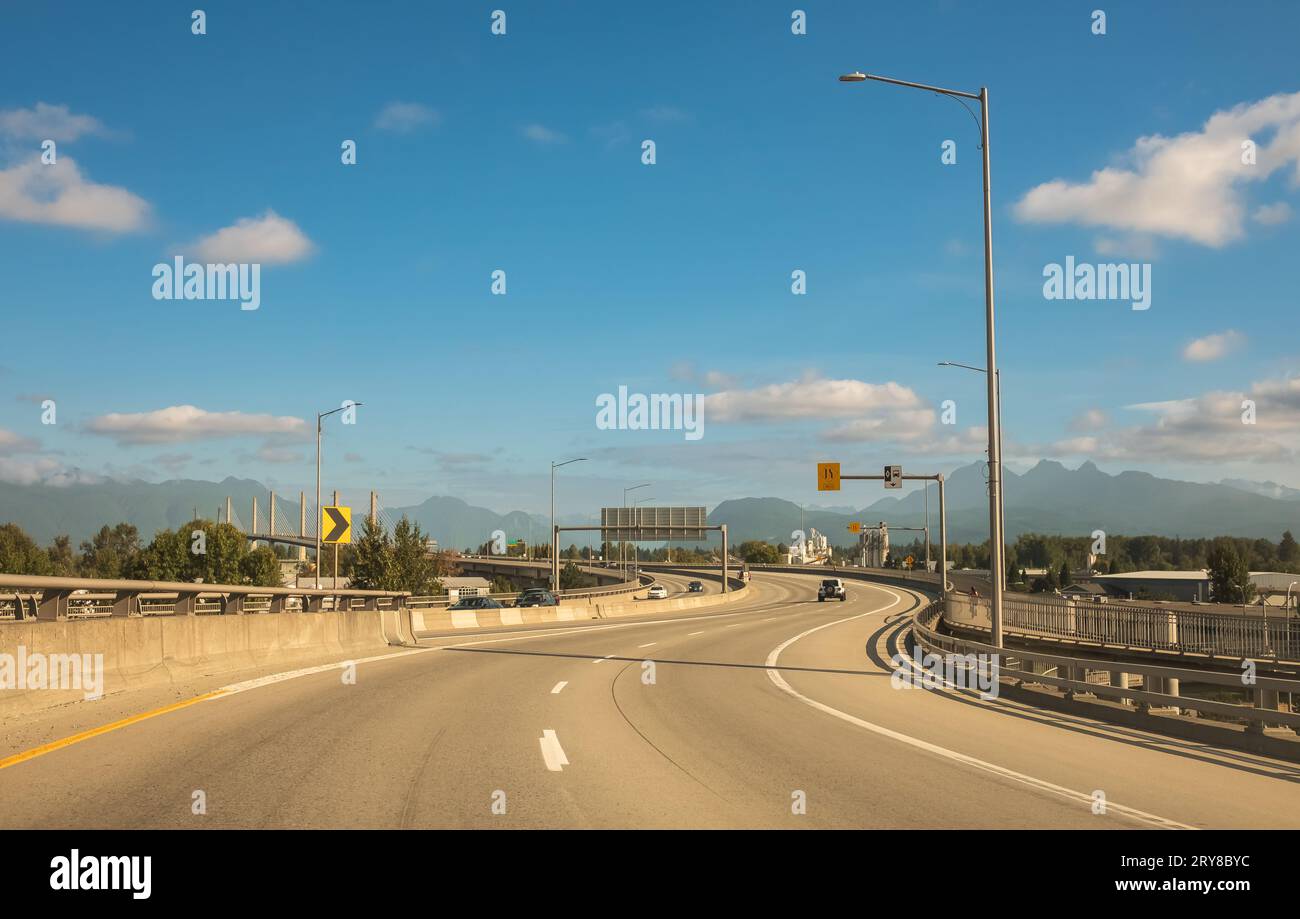 Cars drive through an elevated highway. Trans-Canada Highway. The ...