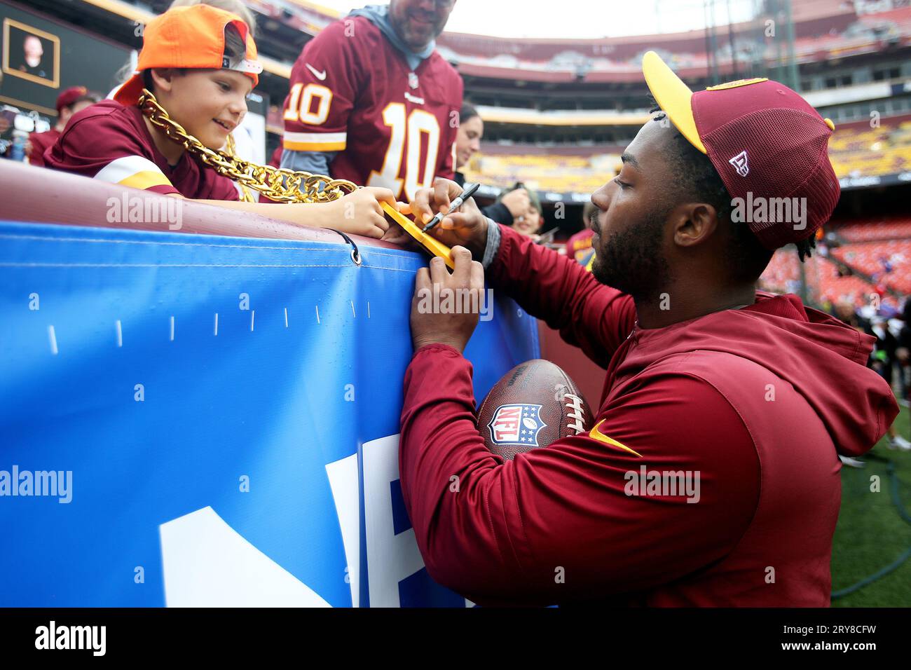 Washington Commanders running back Antonio Gibson (24) signs an ...