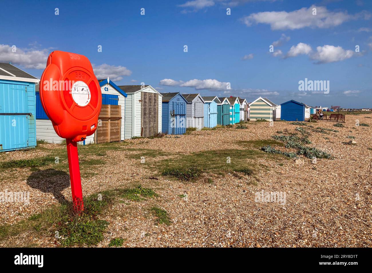 Colourful beach huts stand in a row at the beach. Southampton, United ...